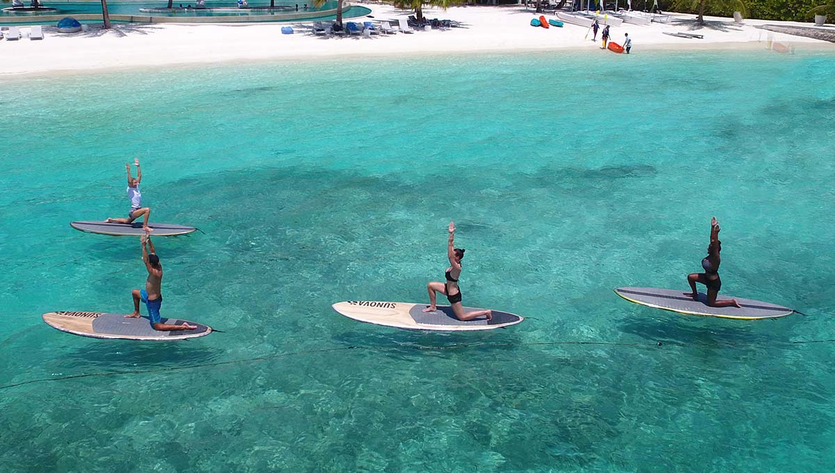 Yoga Classes in Maldives | Stand Up Paddleboard Yoga | Kandooma